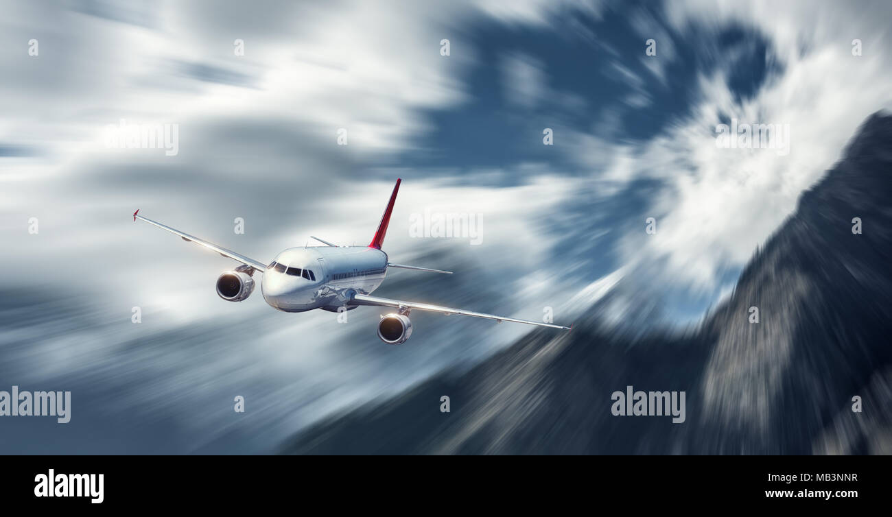 Passenger aircraft in motion. Modern airplane mith motion blur effect ...