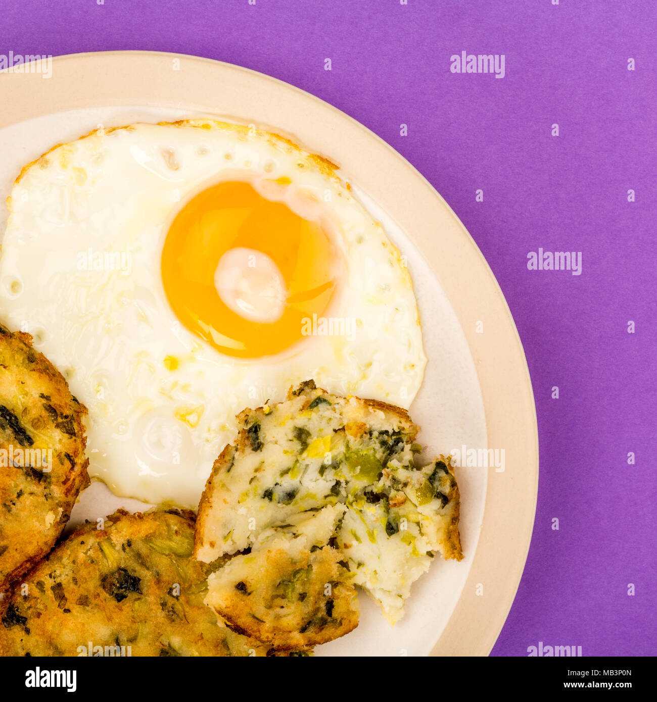 Fried Egg on a Plate With Bubble and Squeak Patties Meal Stock Photo ...