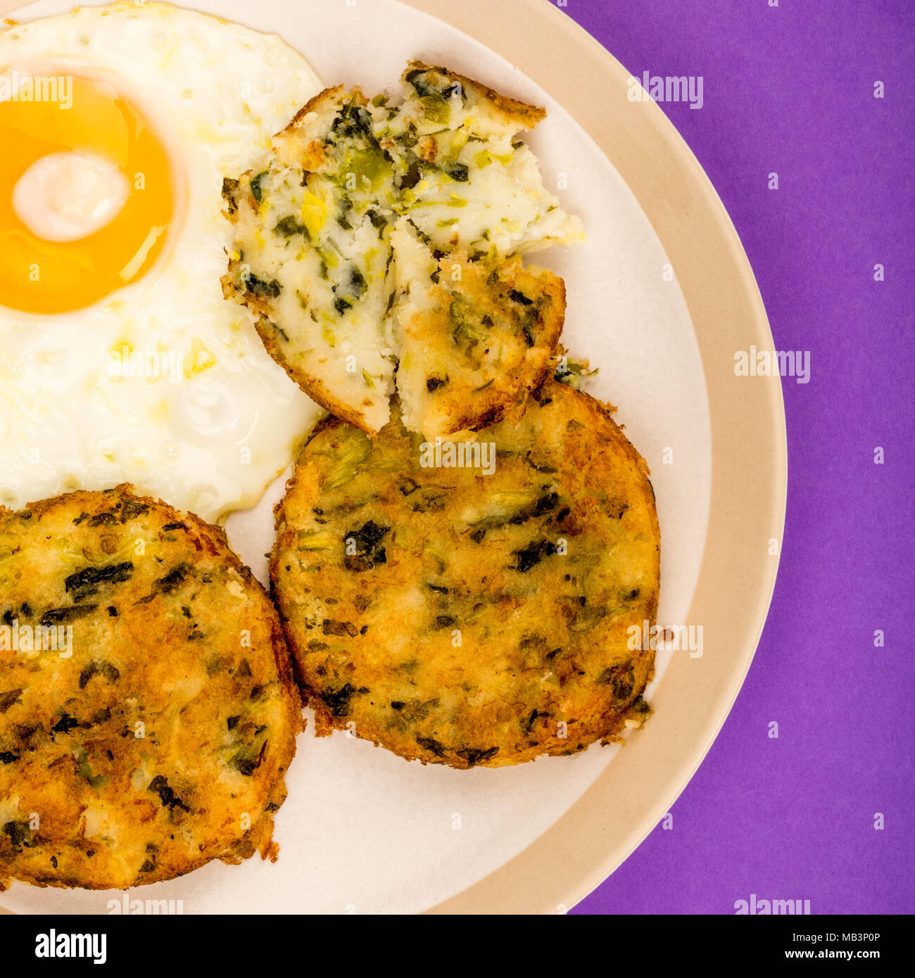 Fried Egg on a Plate With Bubble and Squeak Patties Meal Stock Photo ...