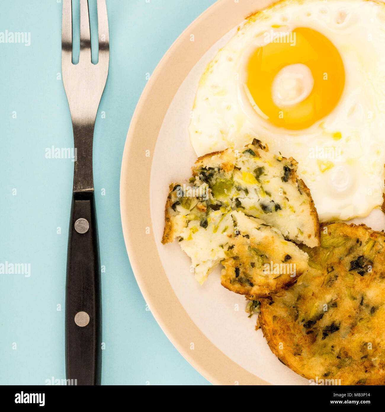Fried Egg on a Plate With Bubble and Squeak Patties Meal Stock Photo ...