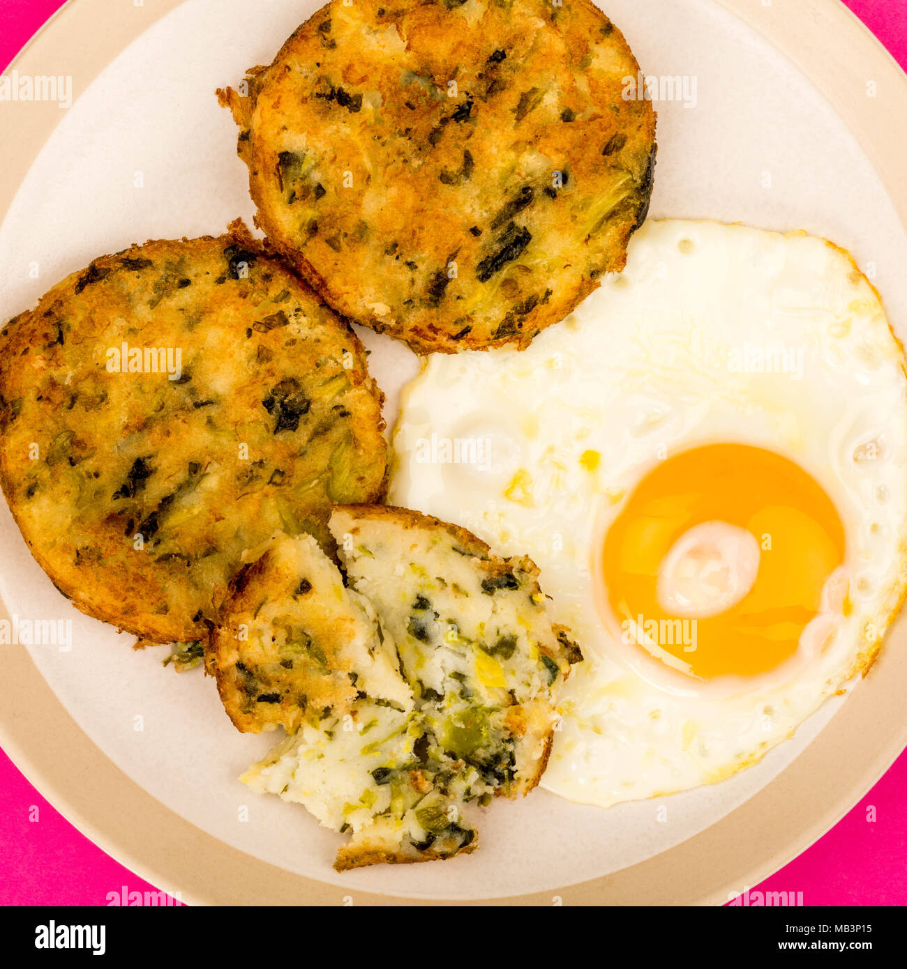 Fried Egg on a Plate With Bubble and Squeak Patties Meal Stock Photo ...
