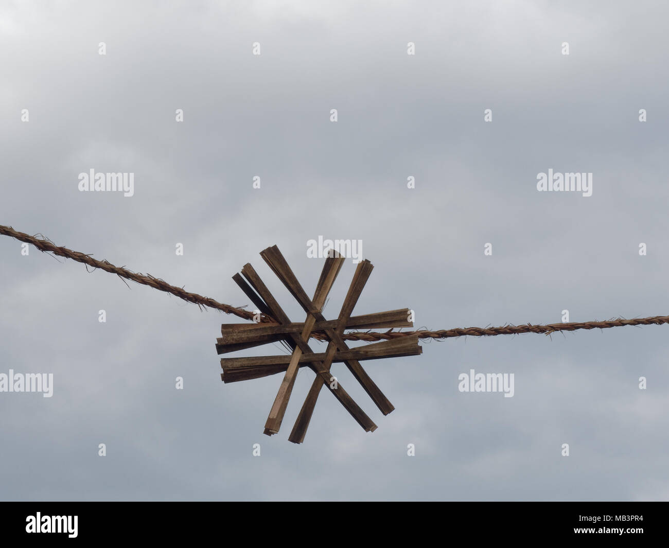 Iconic thin bamboo stripes weaved in star shape hanged by rope over Tha ...