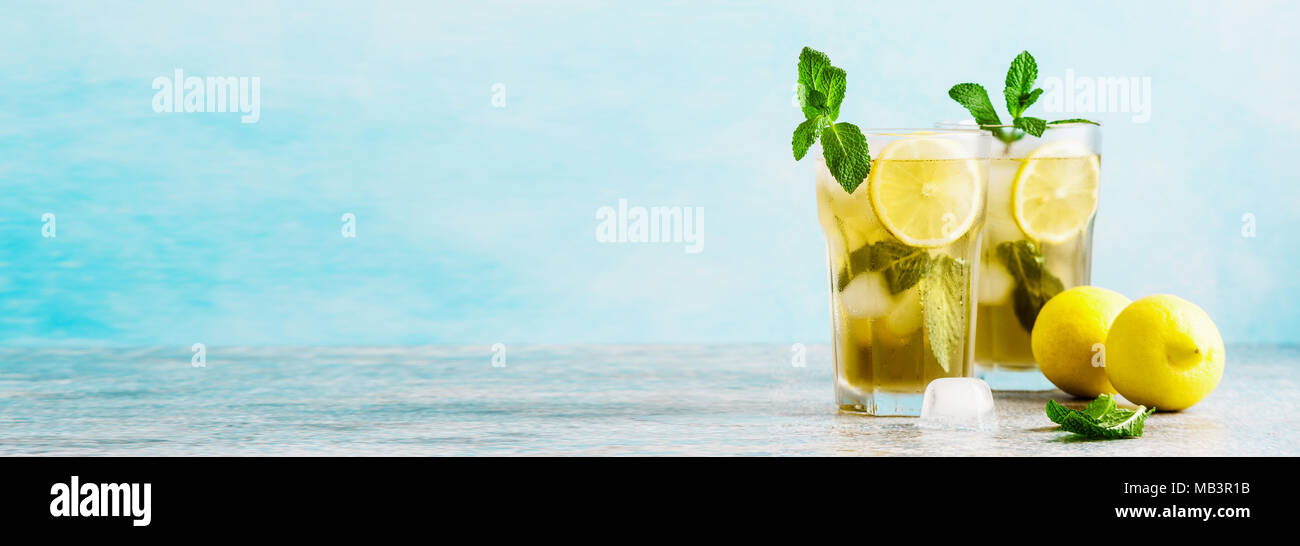 Traditional iced tea with lemon and ice in tall glasses. Banner Stock ...