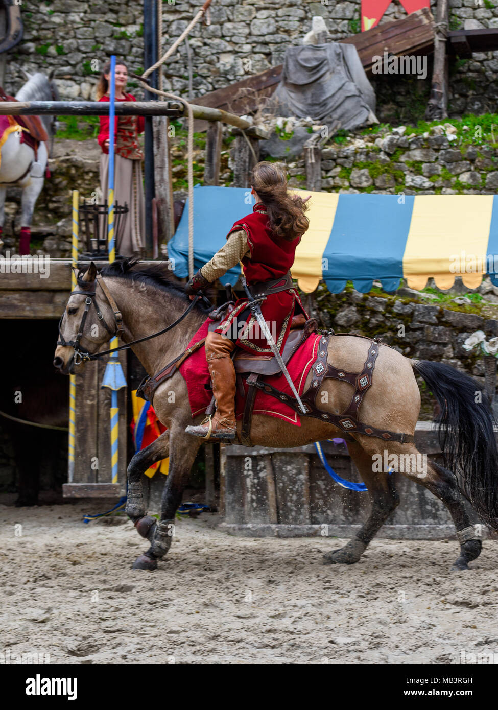 PROVINS, FRANCE - MARCH 31, 2018: Unidentified knight in red rides a ...