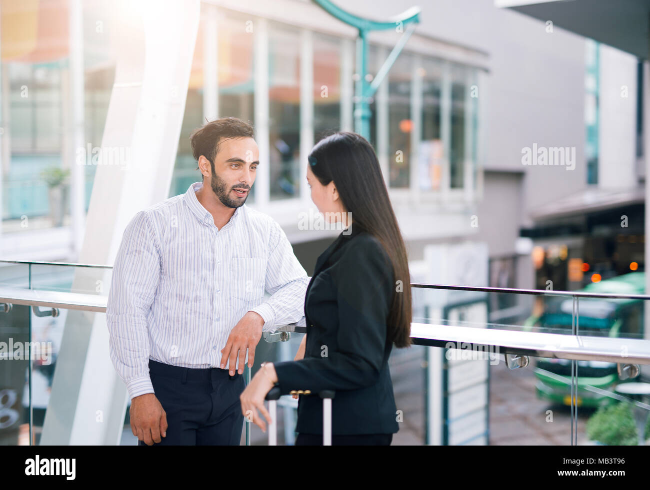 Business colleagues talking together outdoor Stock Photo - Alamy