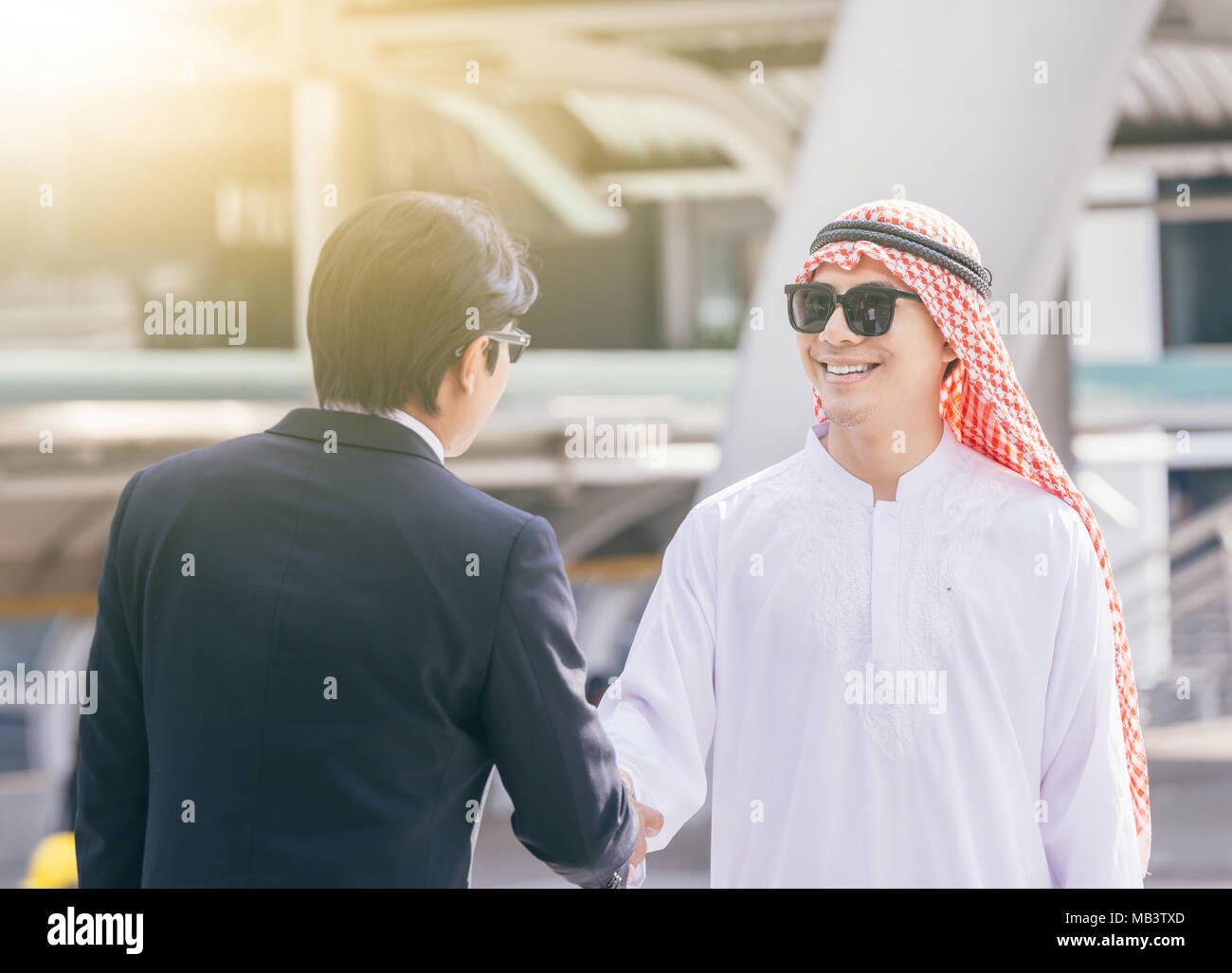 handshake concept.Arabic business and Businessman shaking hands Stock ...