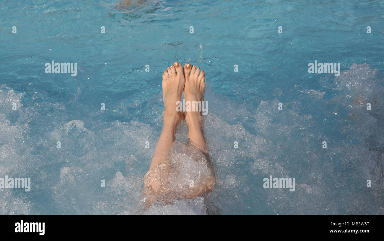 feet of woman during the whirlpool therapy in the spa pool Stock Photo ...
