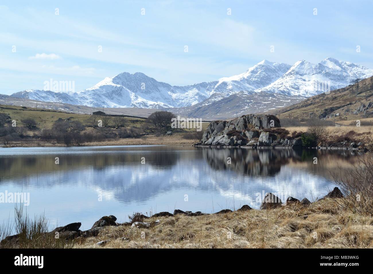 A view of Snowdon, North Wales with the reflection of the snow covered ...