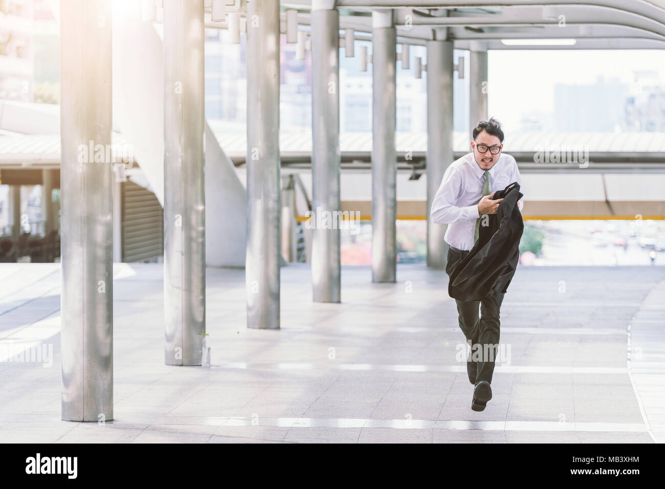 Stressed anxious businessman in a hurry and running, he is late for his ...