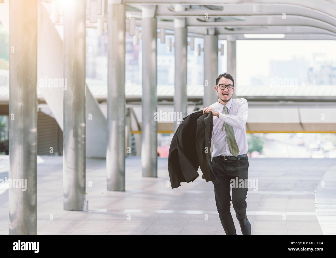 Stressed anxious businessman in a hurry and running, he is late for his ...