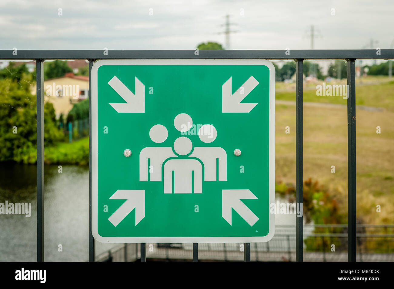 Sign with pictogram for assembly point in case of catastrophe, flood ...