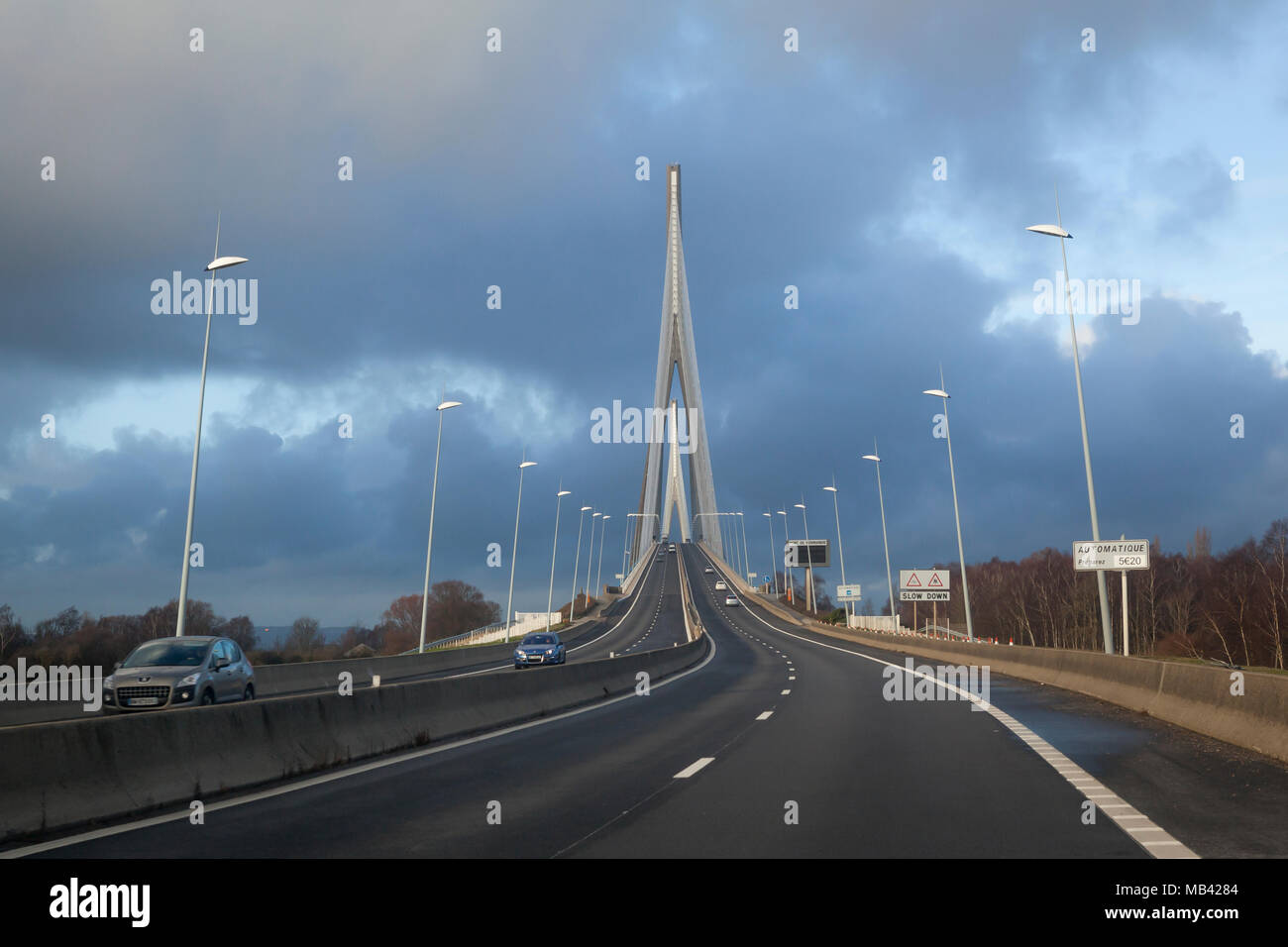 Traffic passing bridge Pont de Normandie crossing the river Seine in ...