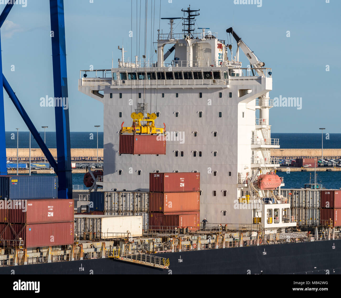 Containers being loaded onto ship in Valencia Stock Photo - Alamy