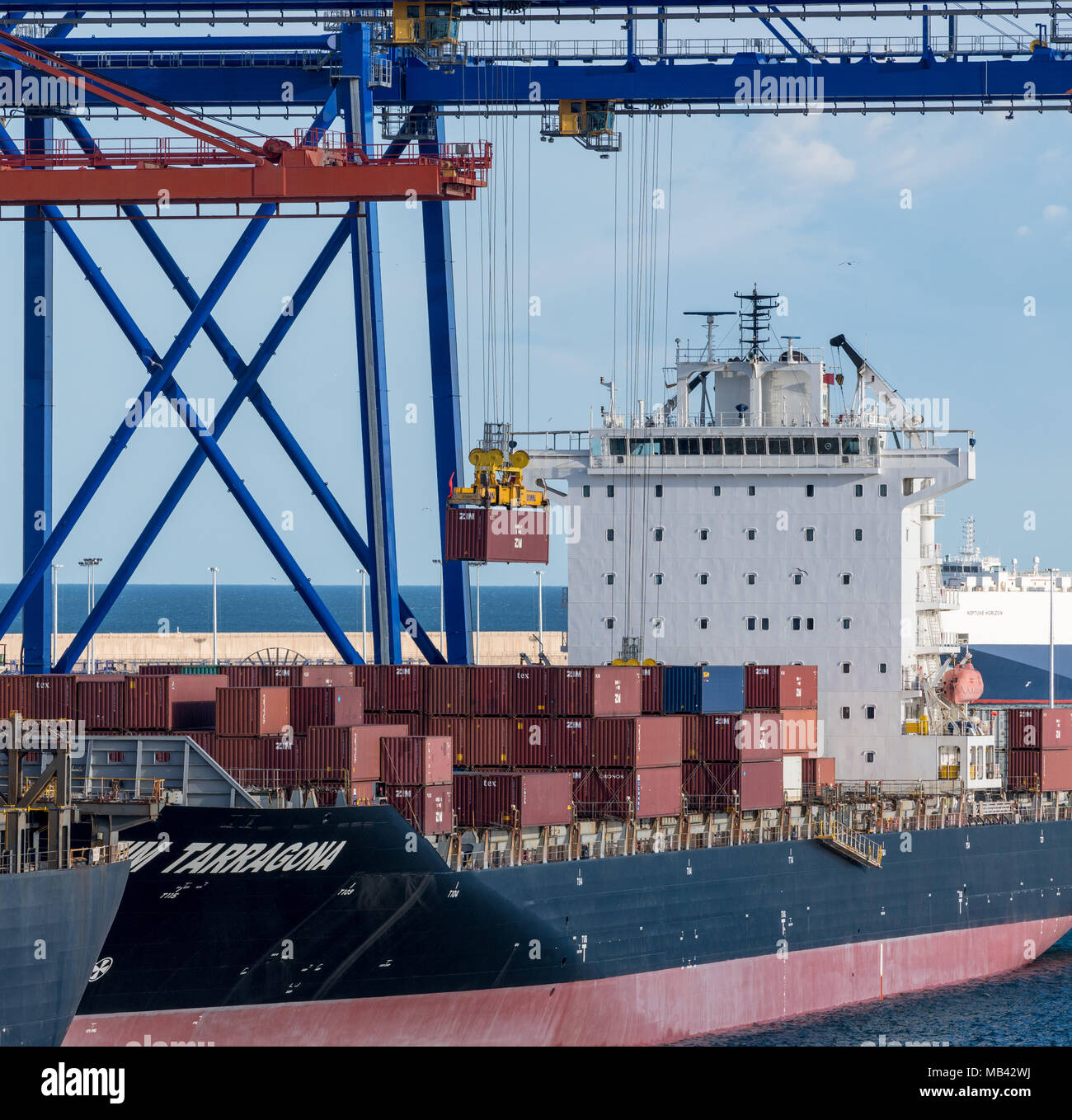 Containers being loaded onto ship in Valencia Stock Photo - Alamy