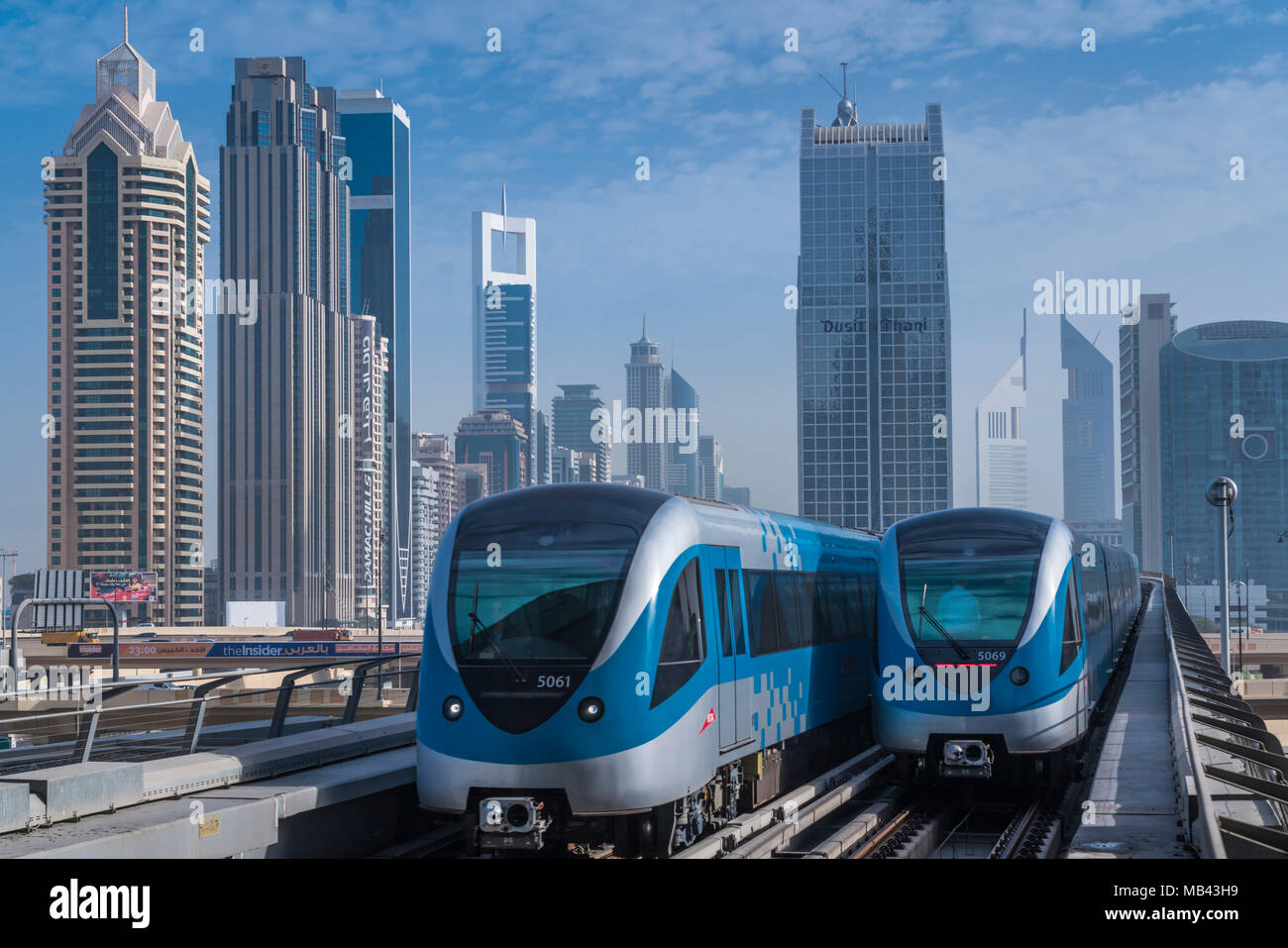 Tall buildings and the Metro train track in downtown Dubai, UAE, Middle ...