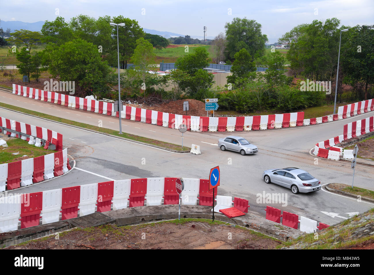 Road barriers erected along the work in progress construction area ...