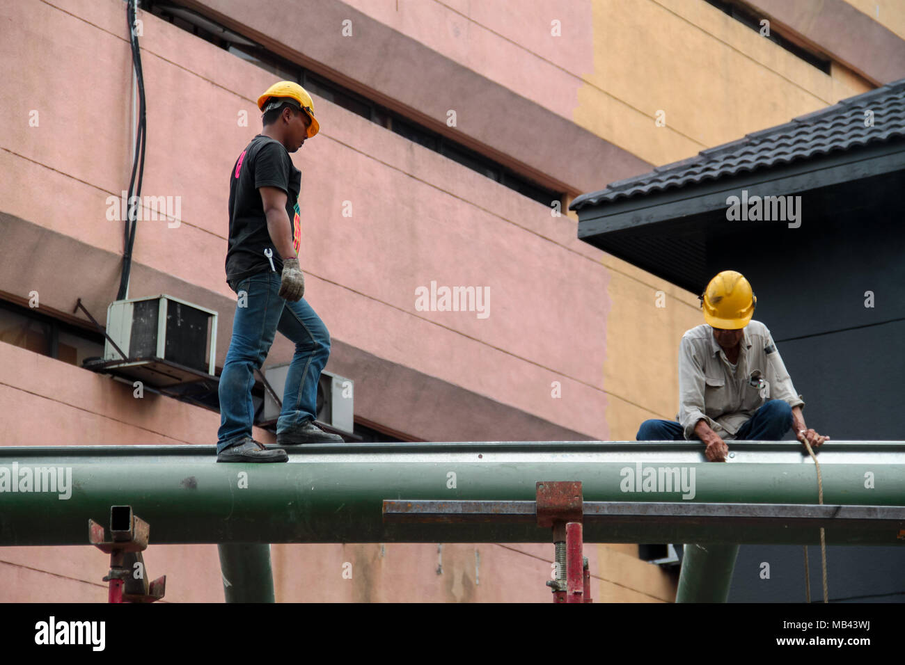 Construction workers building metal structure Stock Photo - Alamy