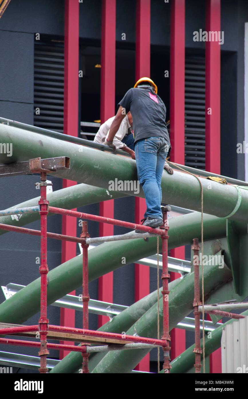 Construction workers building metal structure Stock Photo - Alamy