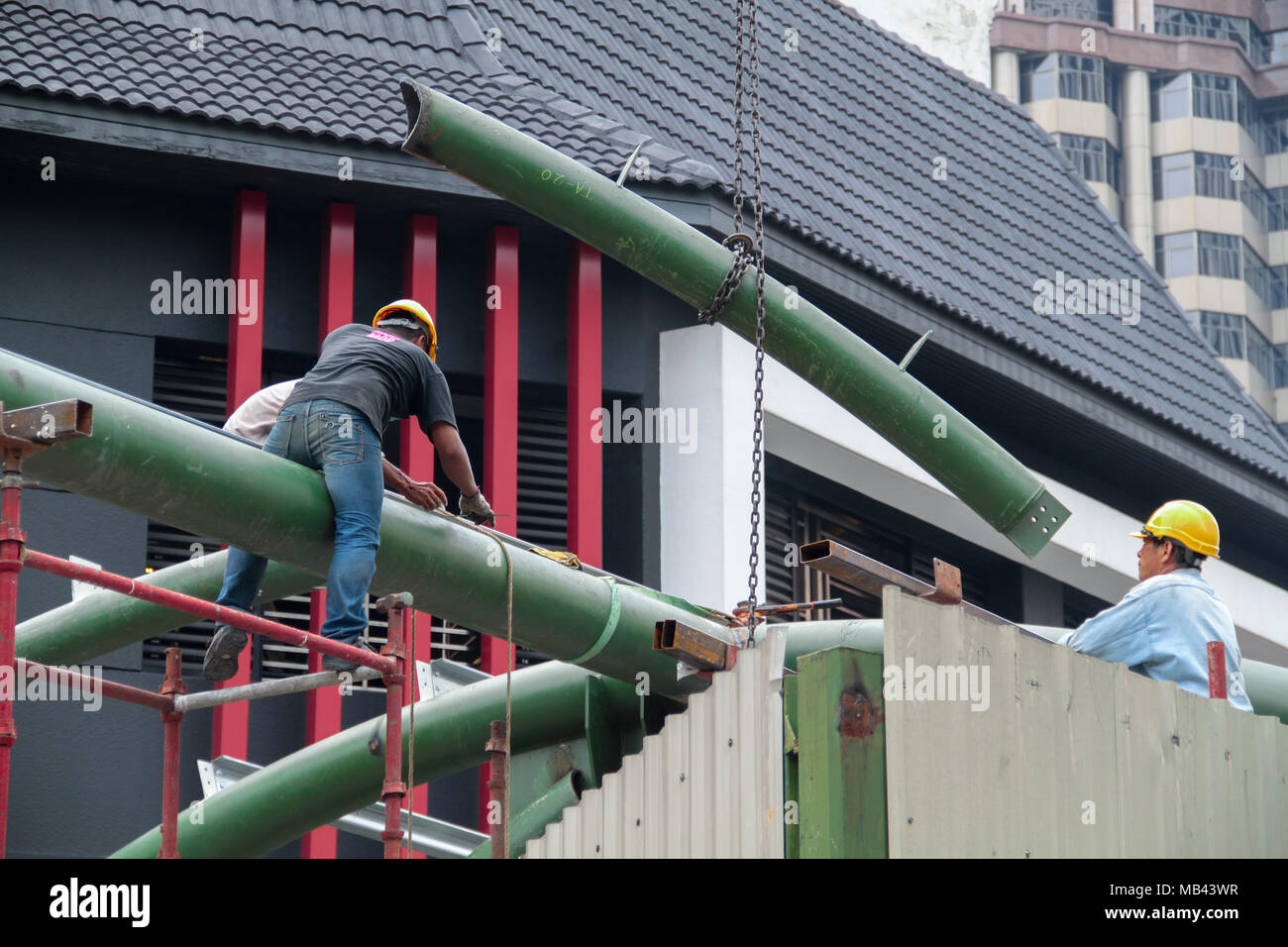 Construction workers building a metal structure Stock Photo - Alamy