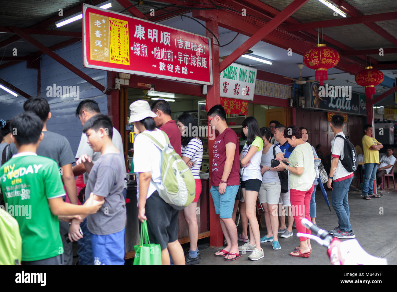 Customers queue outside at a restaurant in Crab island, Malaysia. A ...