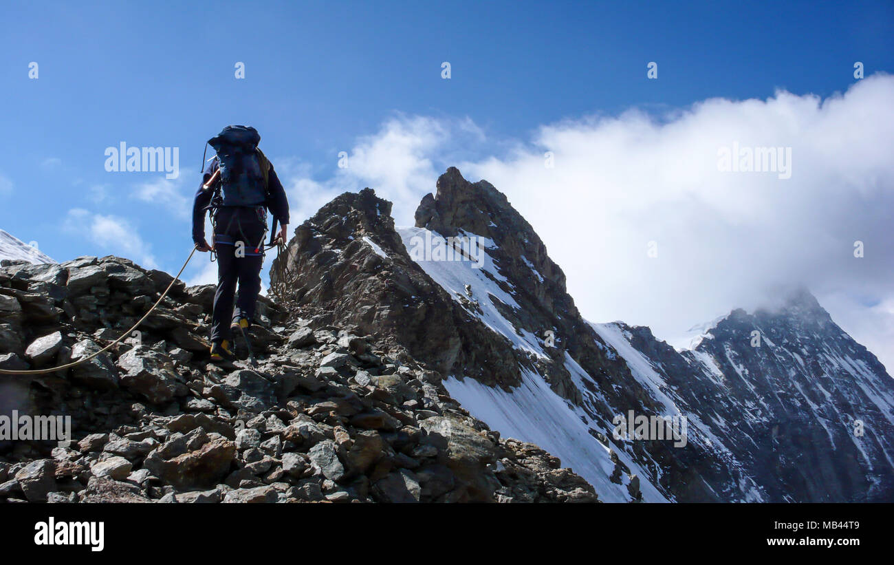 mountain climber on his way to the summit of Eiger mountain in the ...