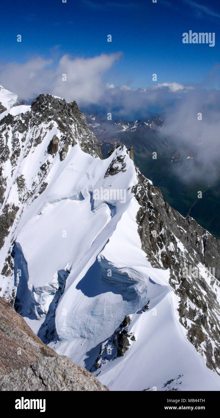 narrow and exposed summit ridge with a giant wave cornice on the way to ...