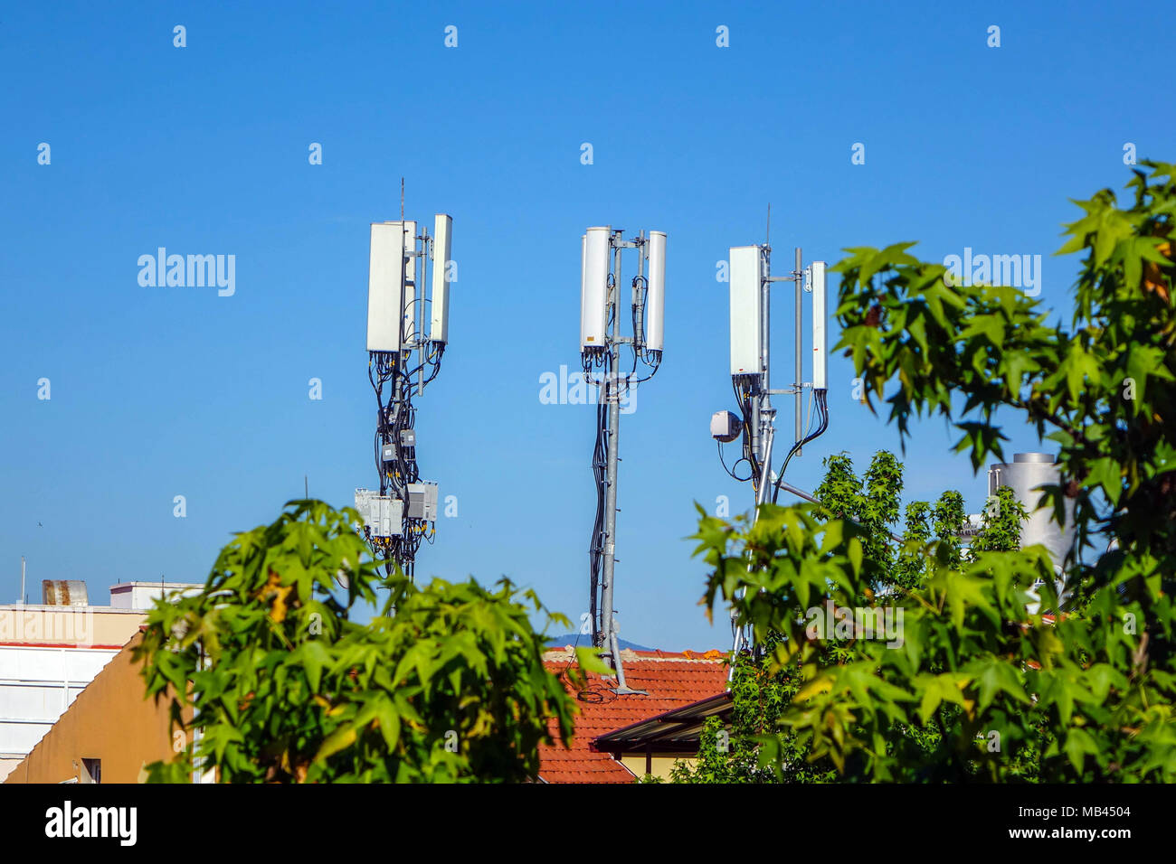 Mobile phone masts above rooftops, Fethiye, Turkey Stock Photo - Alamy