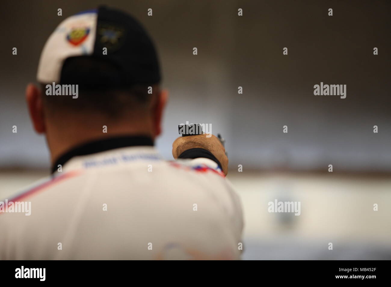 man with a gun fires at the shooting range Stock Photo - Alamy