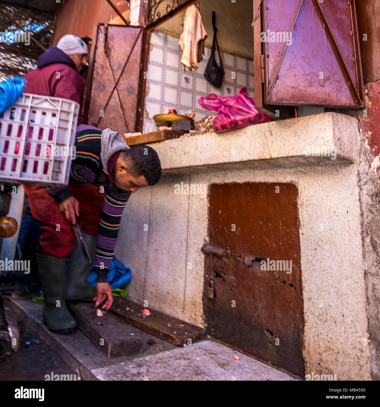 butcher picking fallen meat from the floor Stock Photo - Alamy
