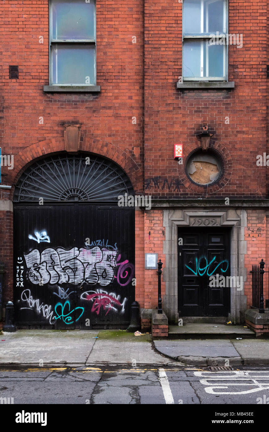 Graffiti on black city gate Stock Photo - Alamy