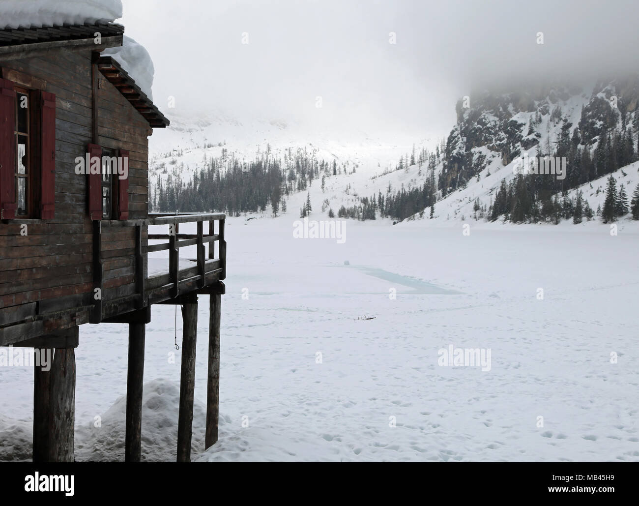stilt house on frozen lake covered with white snow in winter Stock ...
