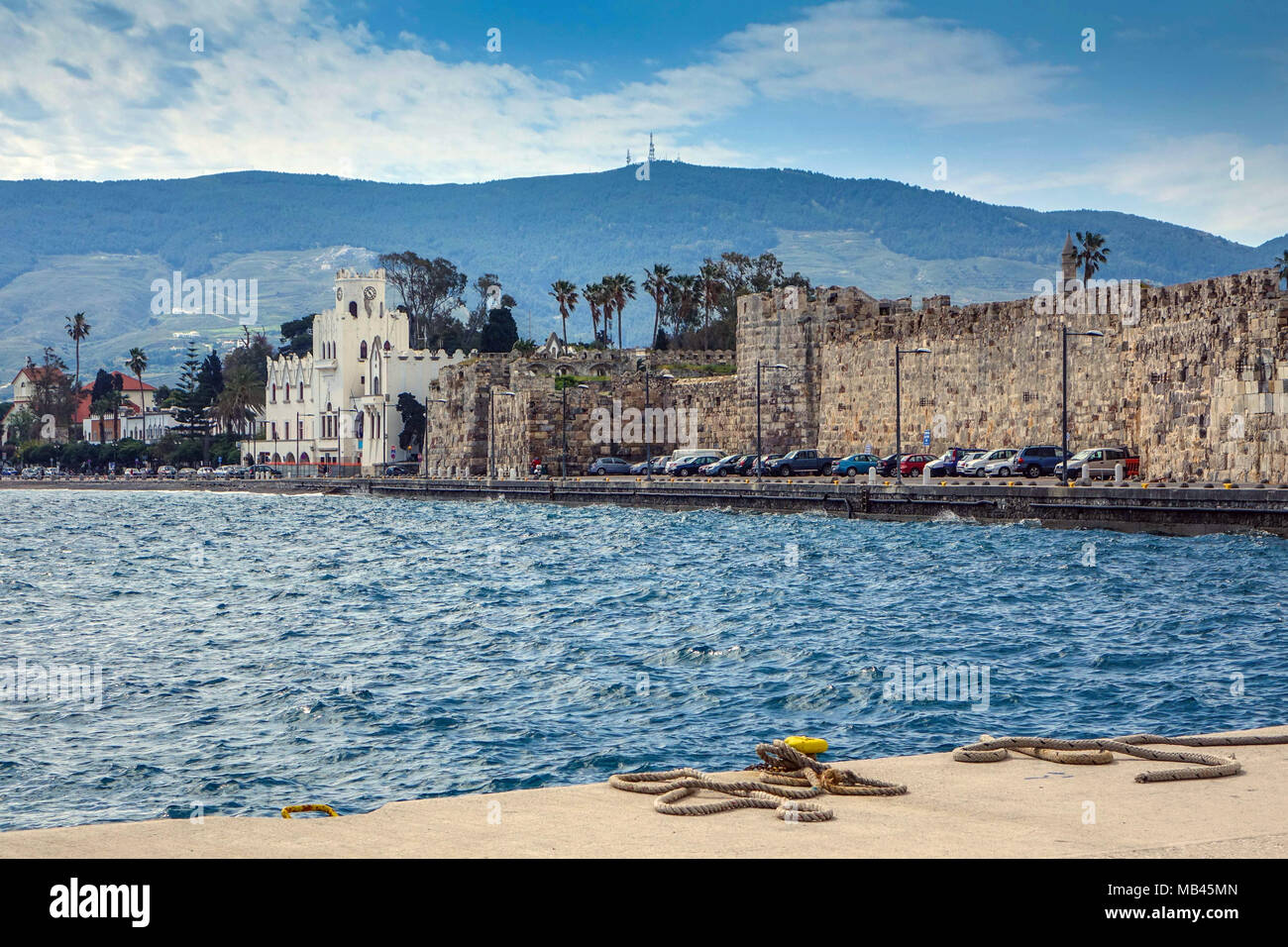 Kos Town with choppy sea. Ancient city walls and town hall, Kos Greece ...