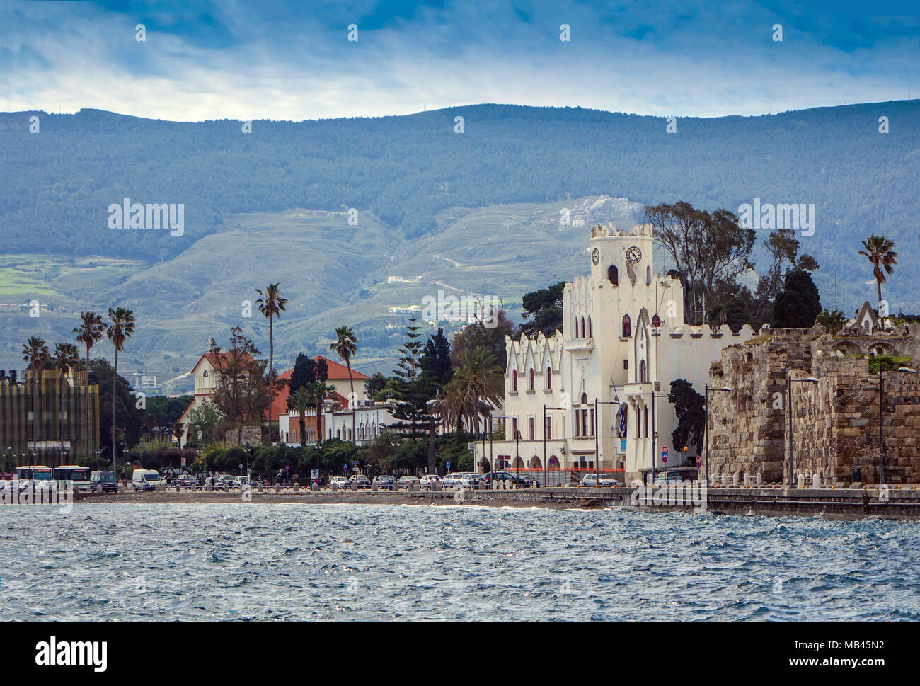 Kos Town with choppy sea. Ancient city walls and town hall, Kos Greece ...