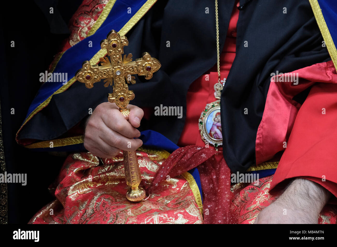 Syrian Orthodox Archbishop holds a Syriac Orthodox cross inside San ...