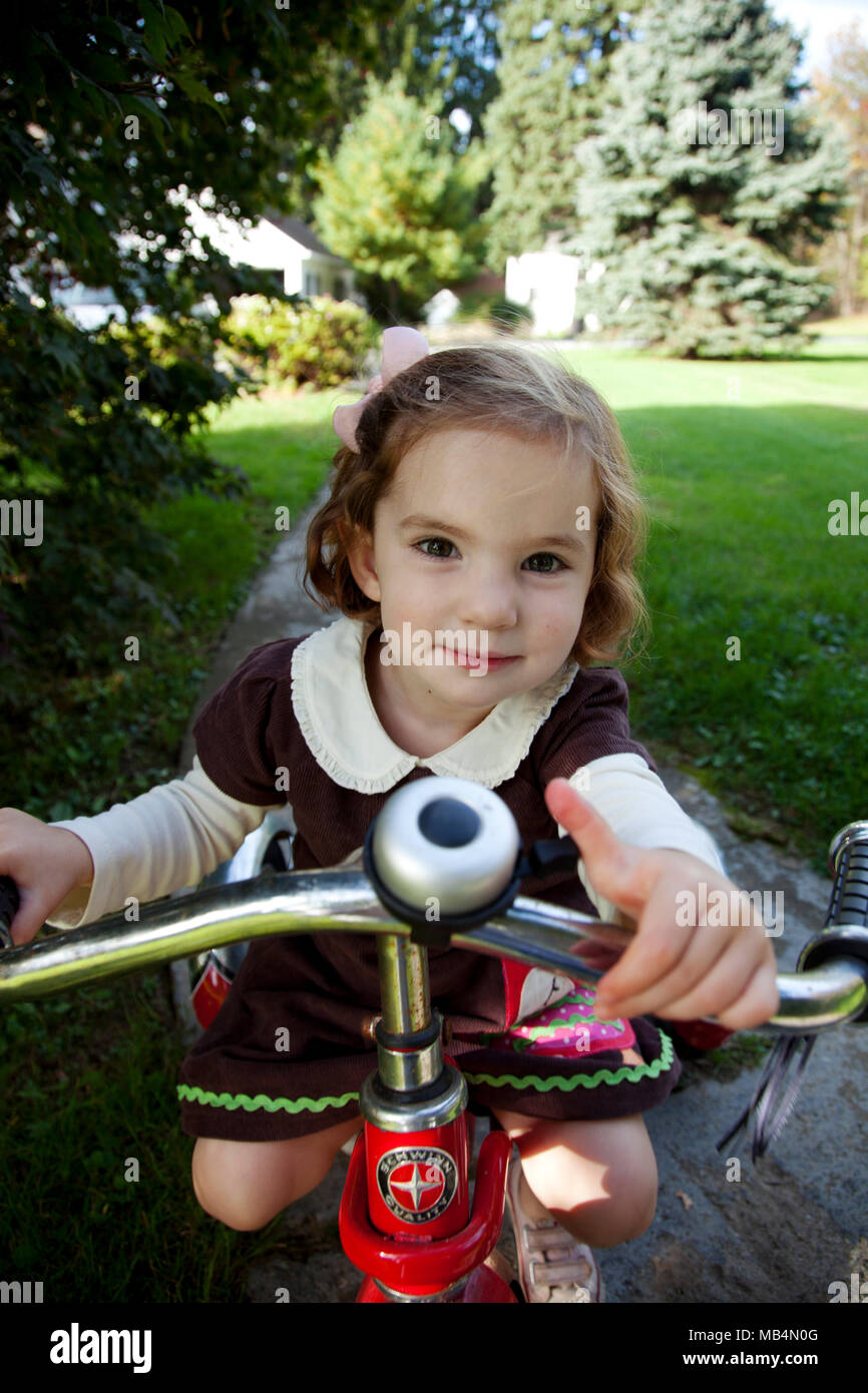 Girl riding tricycle hi-res stock photography and images - Alamy