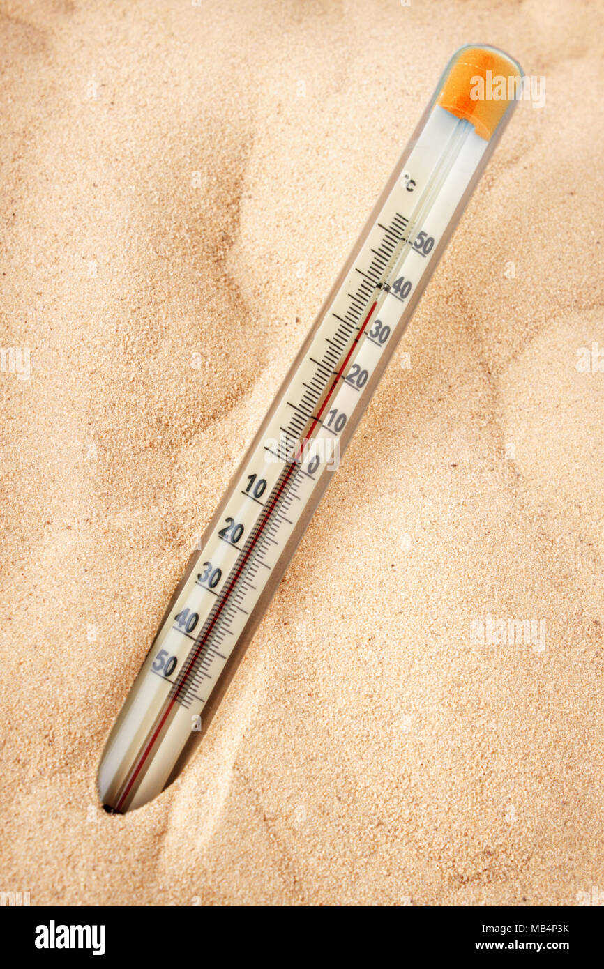Thermometer shows the intense heating of the sand Stock Photo - Alamy