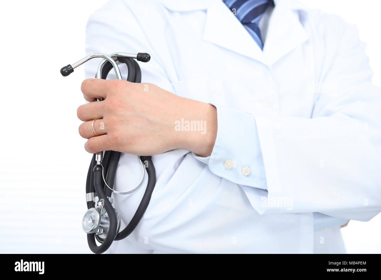 Close Up of Unknown male doctor standing straight while holding ...