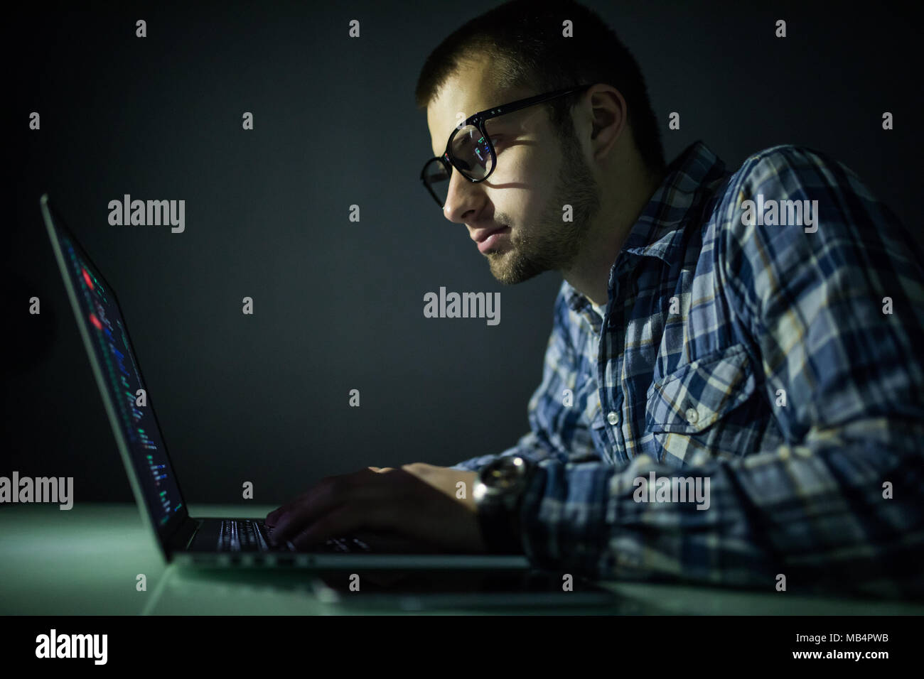 Program development concept. Young man working with computer Stock ...