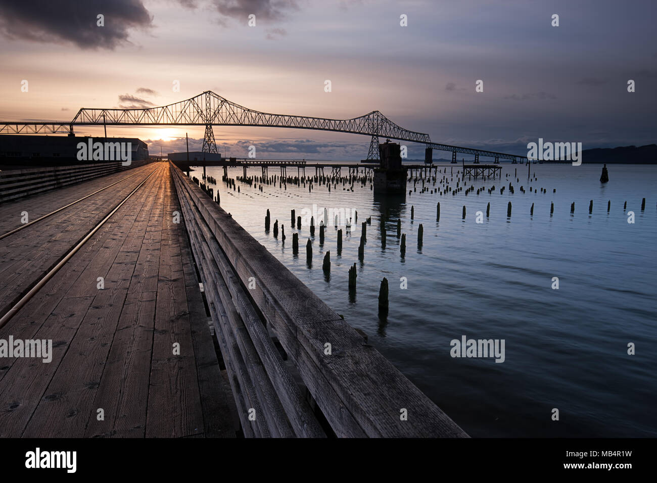 A wooden walkway leads towards the landmark Astoria-Megler bridge in ...