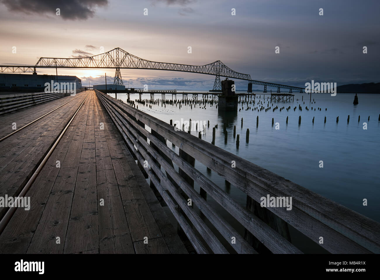 A wooden walkway leads towards the landmark Astoria-Megler bridge in ...