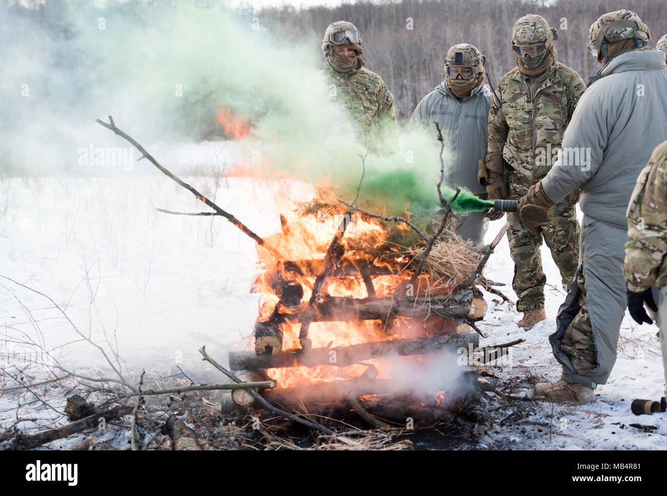 Airmen from the 91st Security Forces Group use an M18 smoke grenade to ...