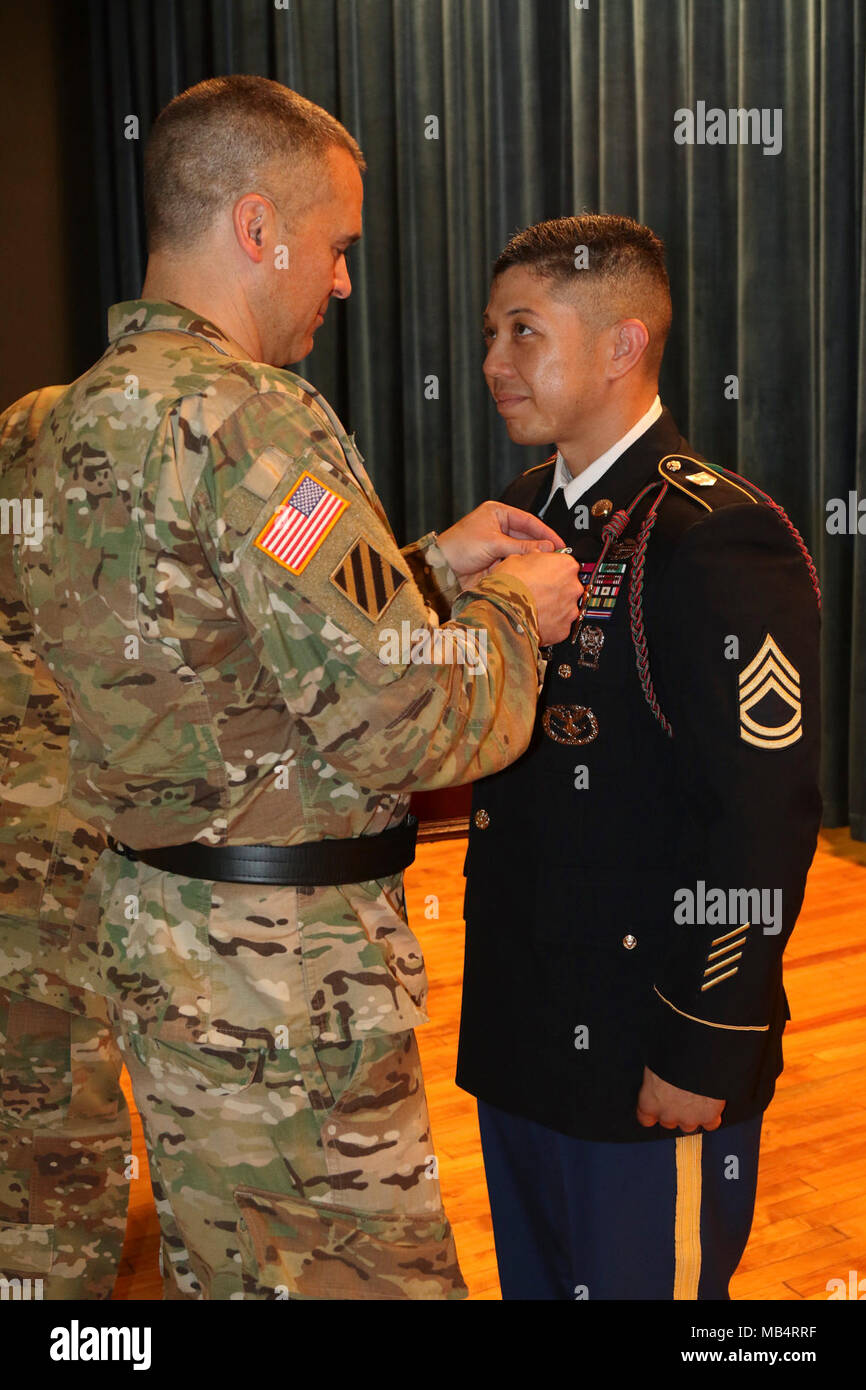 Brig. Gen. Sean Bernabe, Task Force Marne commander, pins an Army ...