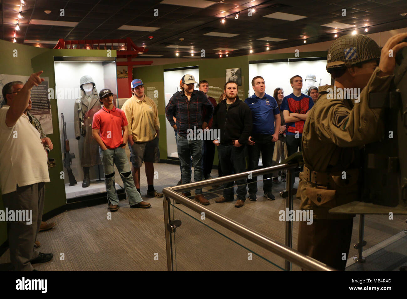 Georgia High School Tech students, look on at the WWII era exhibit at ...