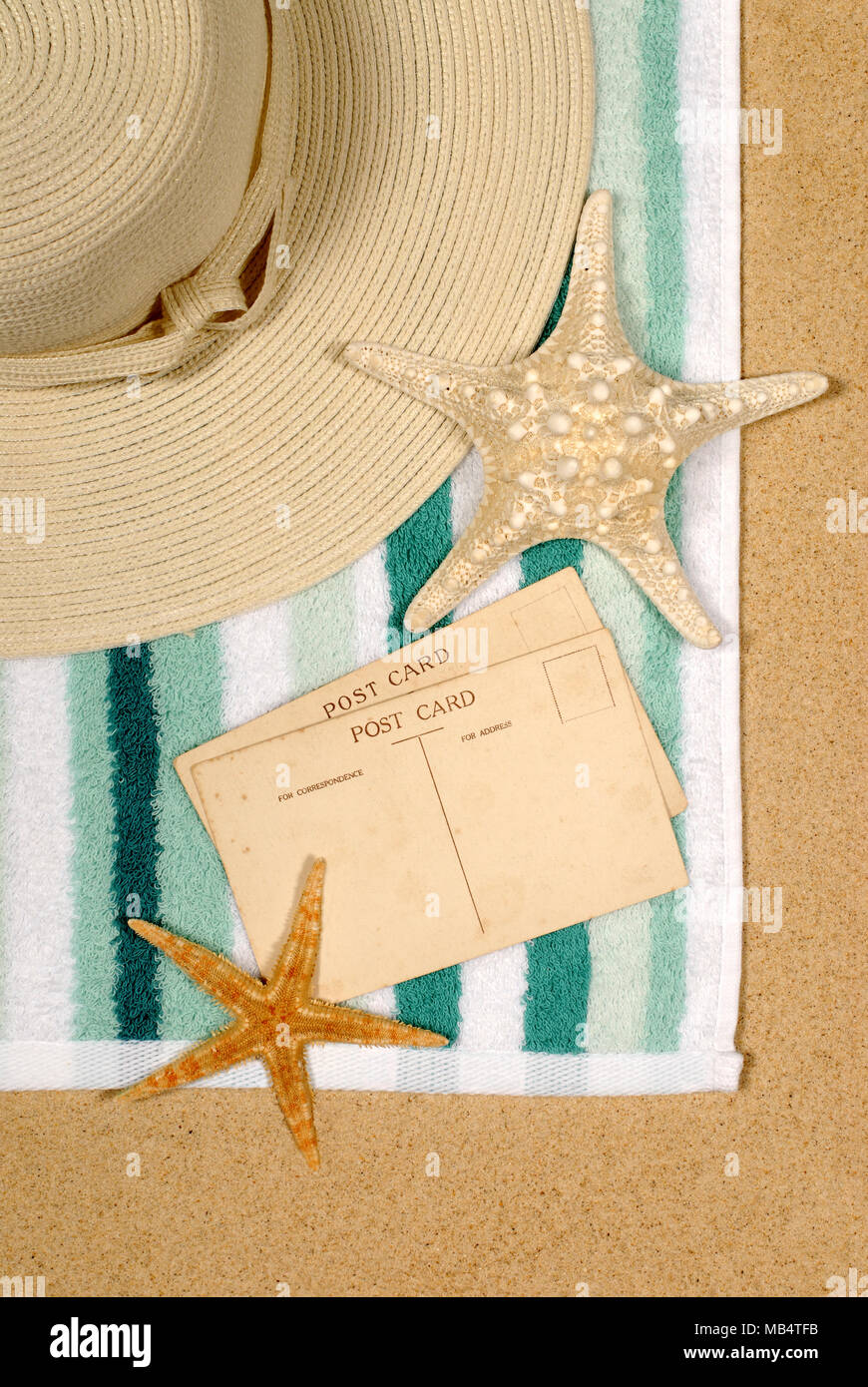 Seashore background with postcards shells beach towel and starfish ...