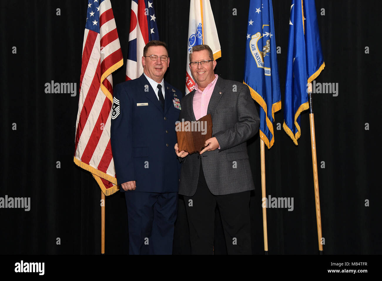 Command Chief Master Sgt. Thomas A. Jones, left, the state command ...