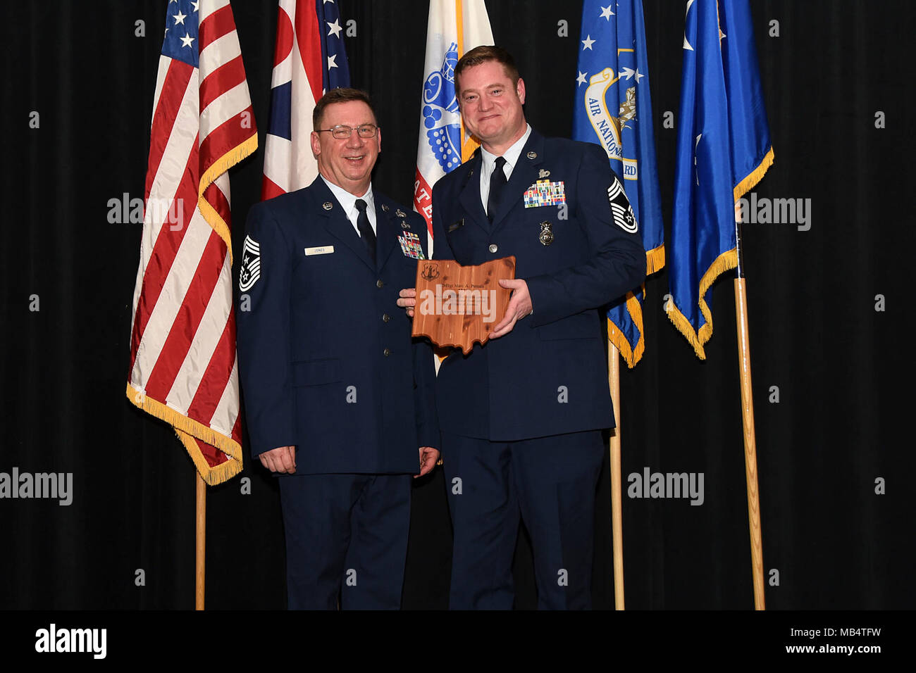 Command Chief Master Sgt. Thomas A. Jones, left, the state command ...