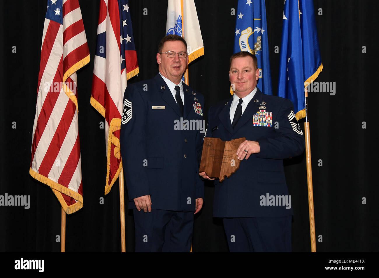 Command Chief Master Sgt. Thomas A. Jones, left, the state command ...