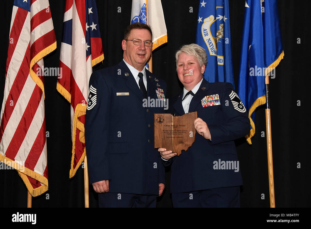 Command Chief Master Sgt. Thomas A. Jones, left, the state command ...