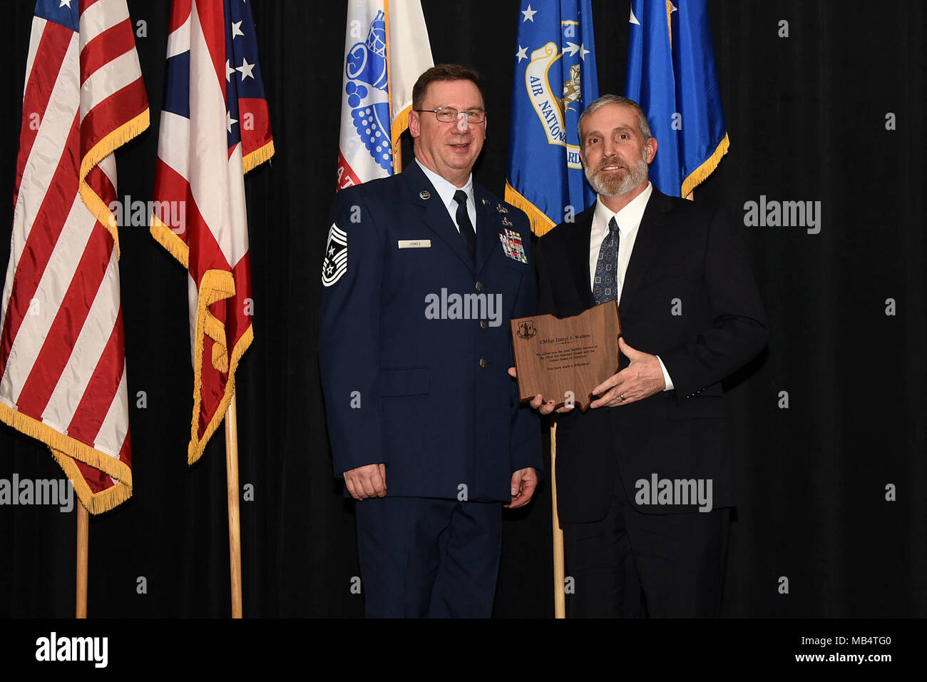 Command Chief Master Sgt. Thomas A. Jones, left, the state command ...
