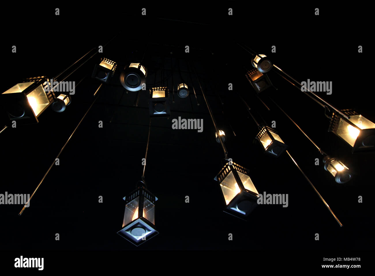 pile of vintage lamp hanging on ceiling with turn on light bulb Stock ...